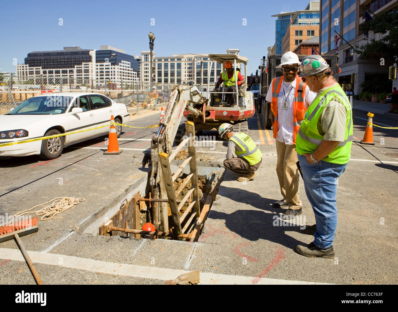 Municipal construction workers digging in city street - Washington, DC ...