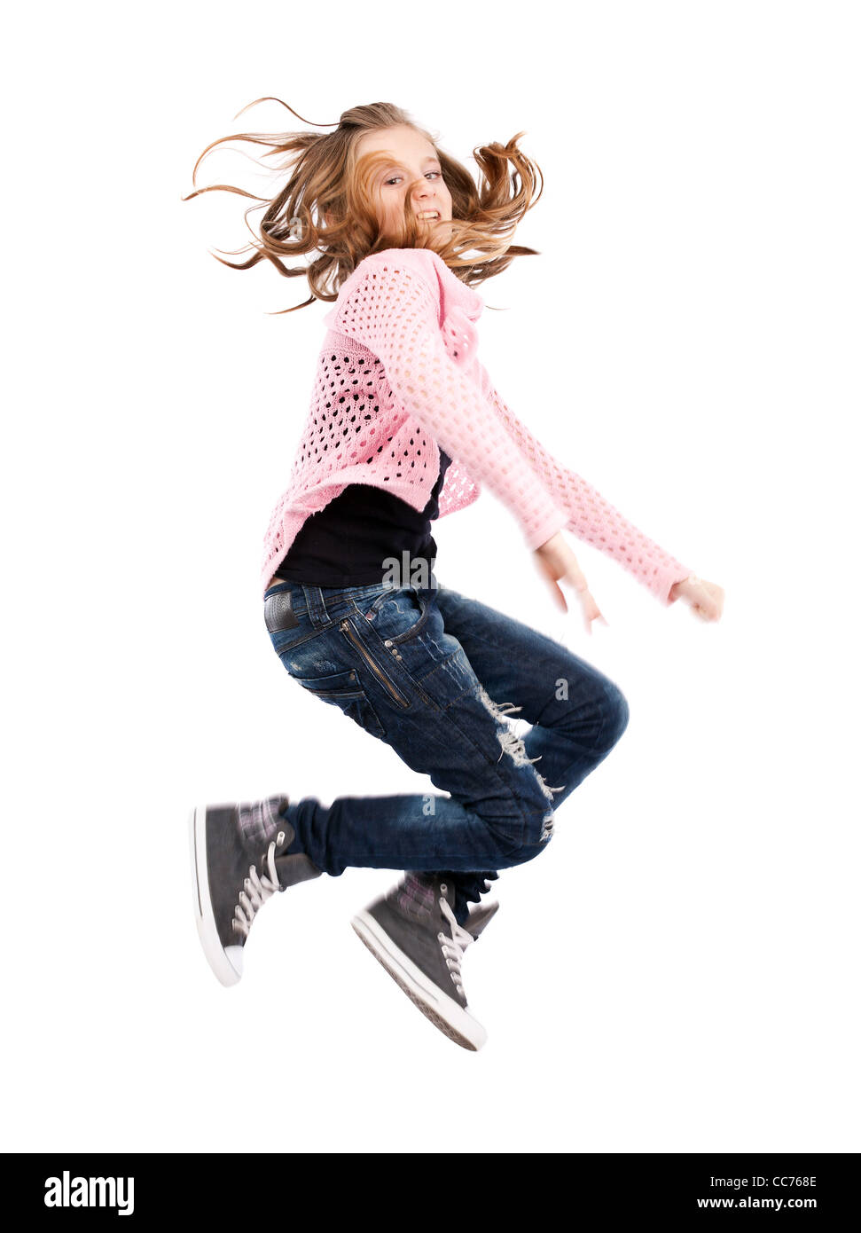 Cute girl jumping for joy isolated on white background Stock Photo - Alamy