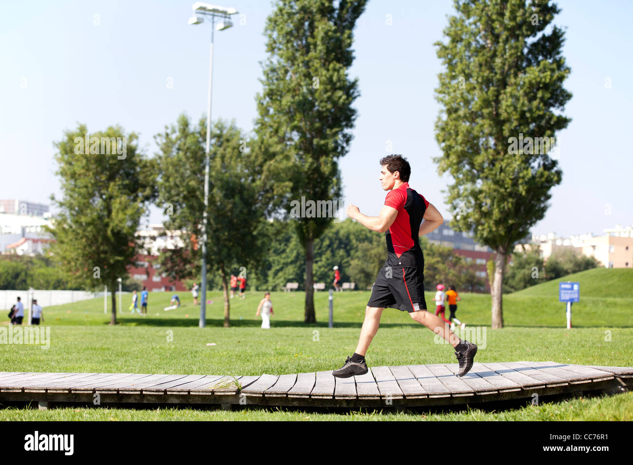 Men athlete running at the city park Stock Photo - Alamy