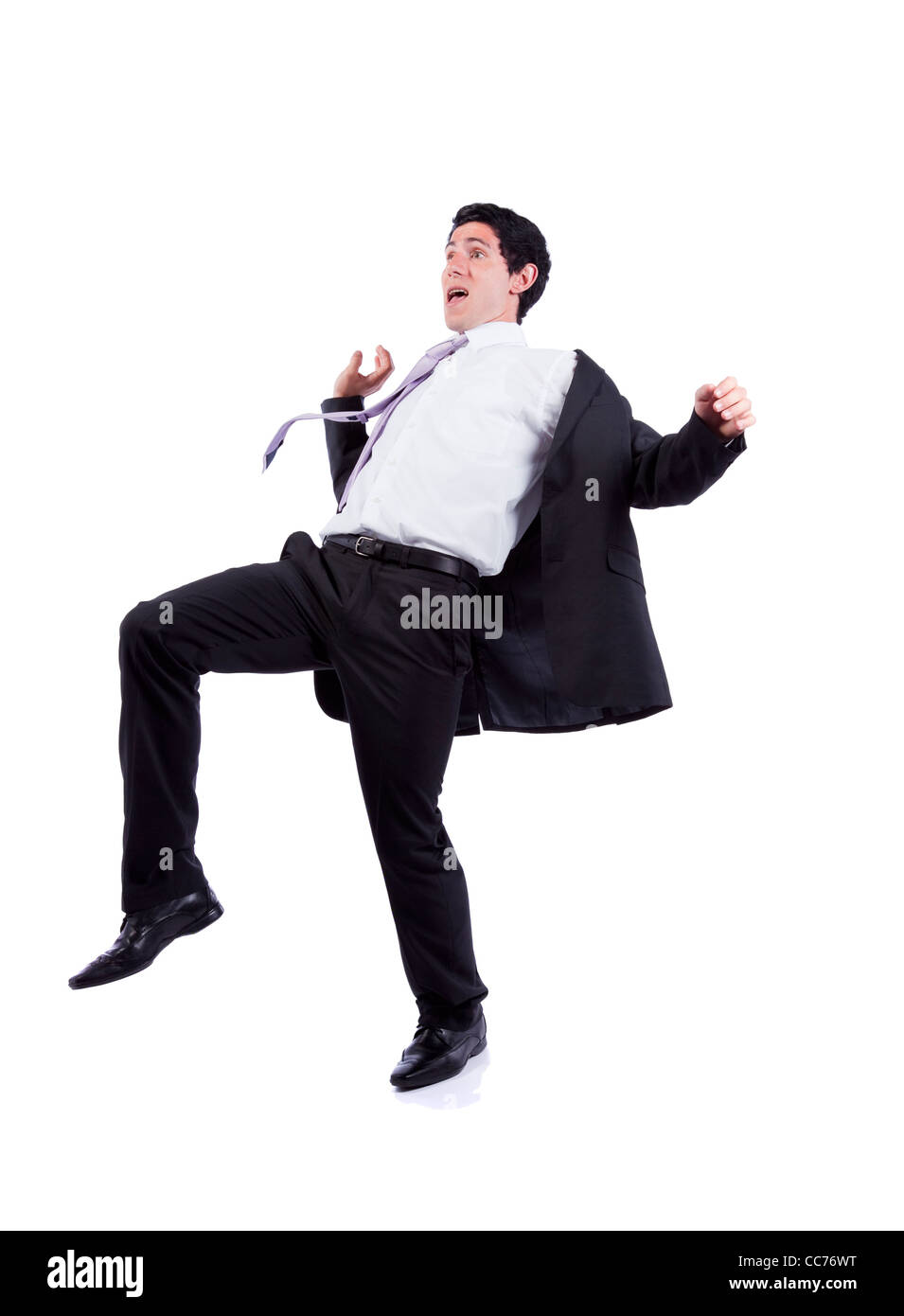 Scared businessman in a falling position (isolated on white Stock Photo ...