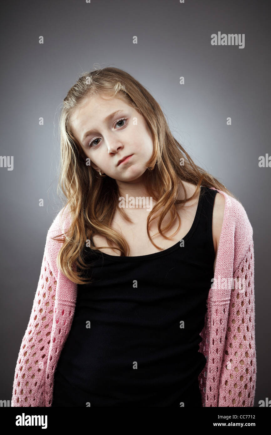 Sad girl studio closeup portrait on gray background Stock Photo - Alamy