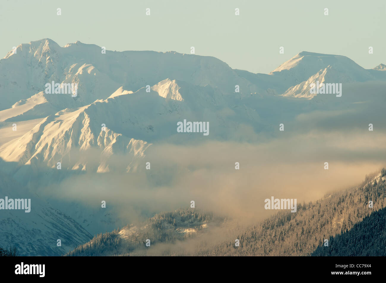 The Sunset Chilkat Valley under a covering of snow, with mountains ...