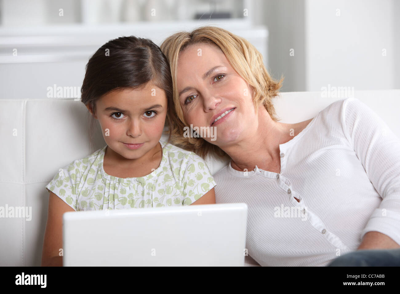 Mother and daughter on laptop Stock Photo - Alamy