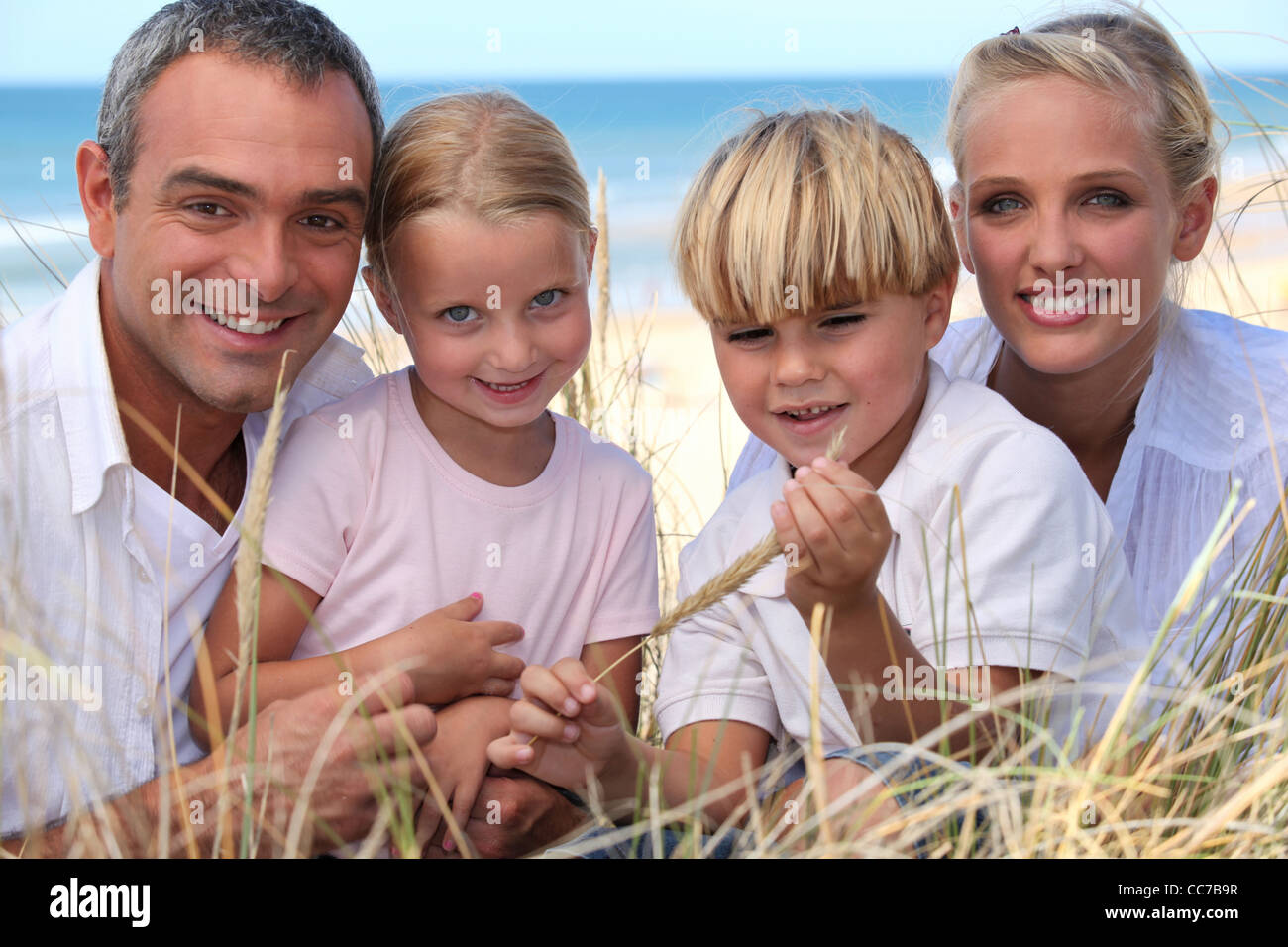 Family spending the day by the seaside Stock Photo - Alamy