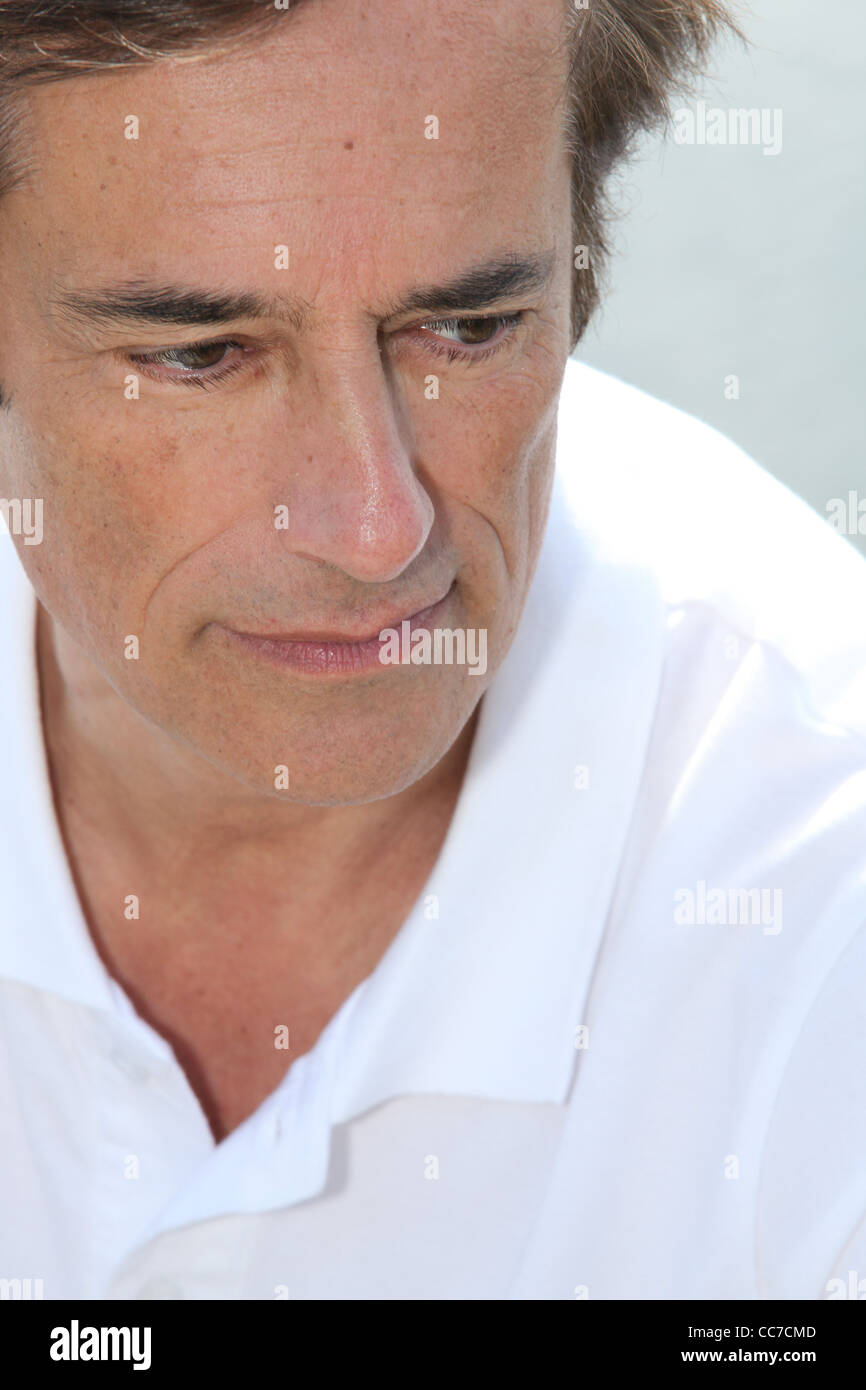 Portrait of concerned man Stock Photo - Alamy