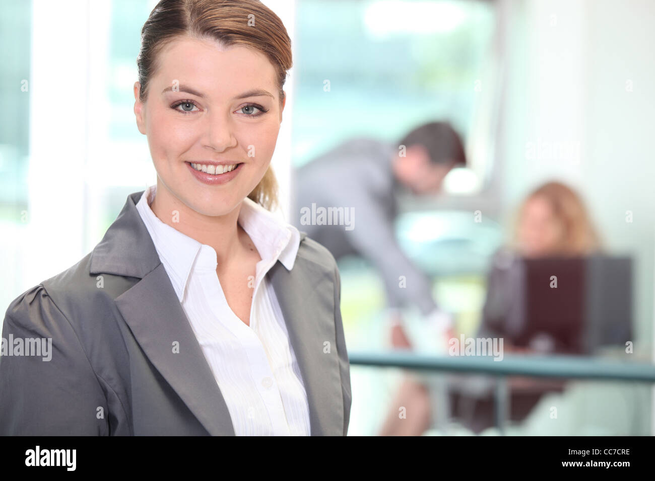 Satisfied employee in gray suit Stock Photo - Alamy