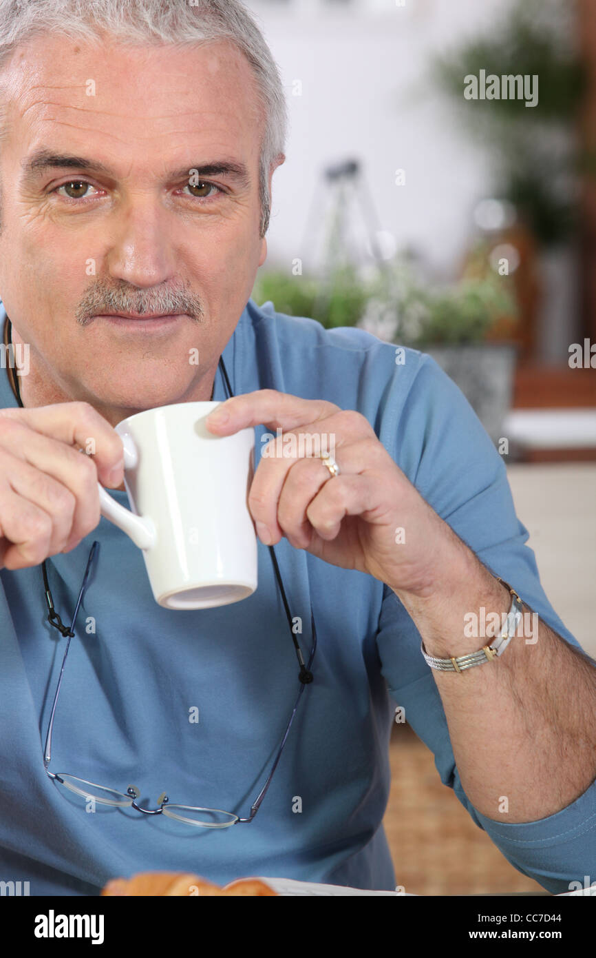 Man drinking coffee alert hi-res stock photography and images - Alamy