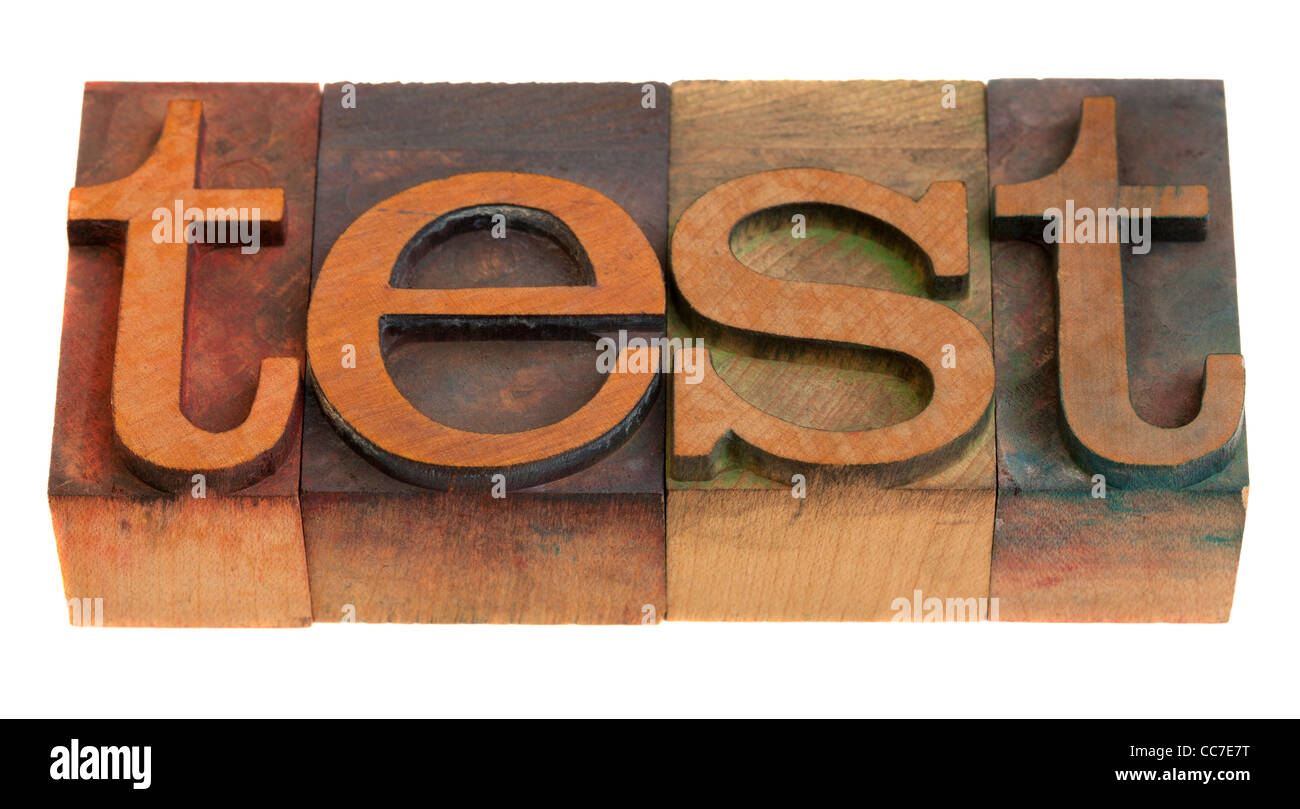 test word in vintage wooden letterpress printing blocks isolated on ...