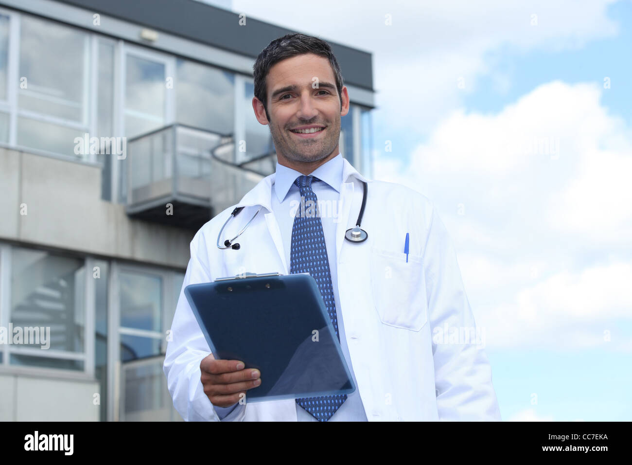 Doctor standing outside a hospital Stock Photo - Alamy