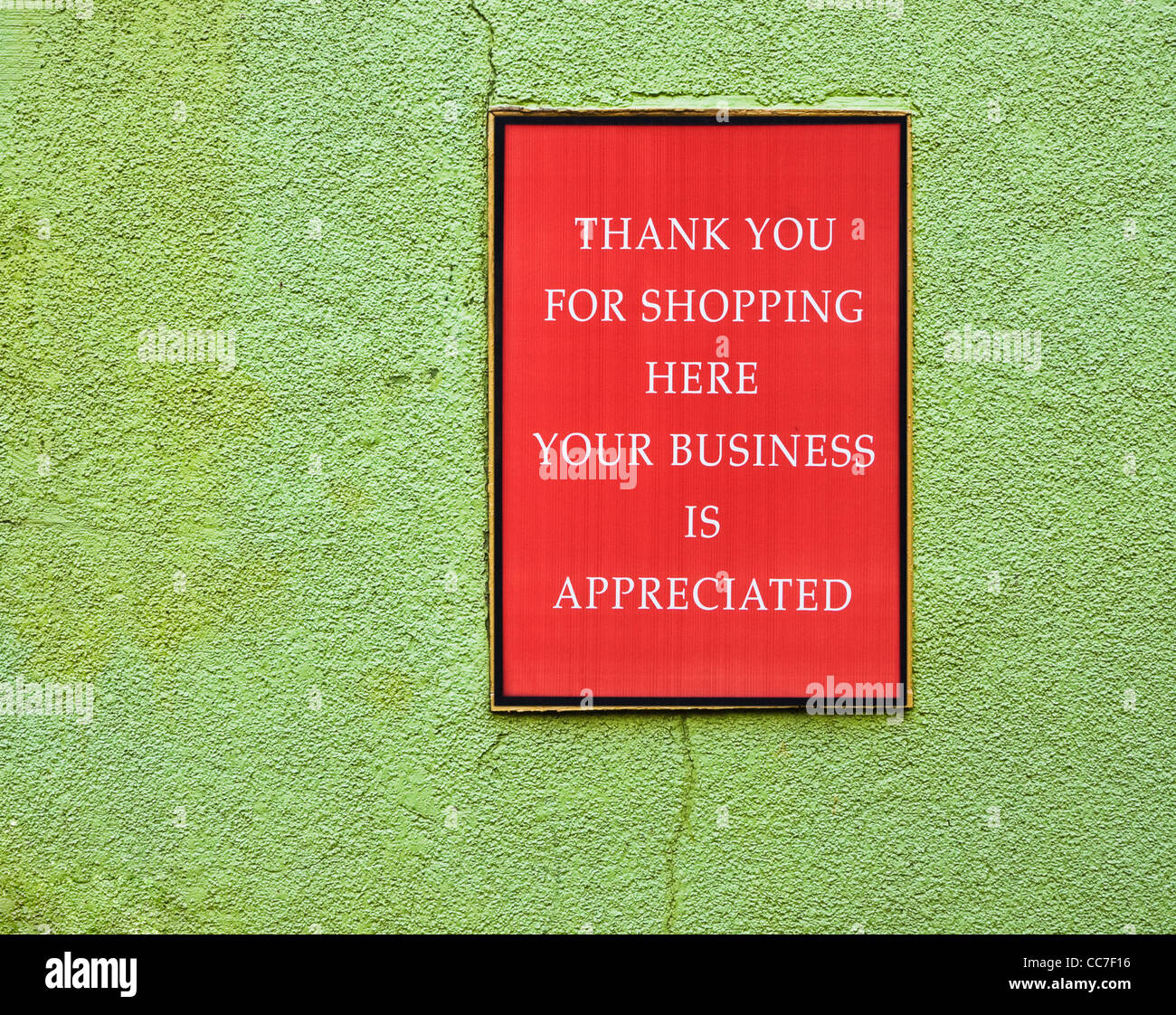 thank you for shopping here sign mounted on outside wall of convenience ...