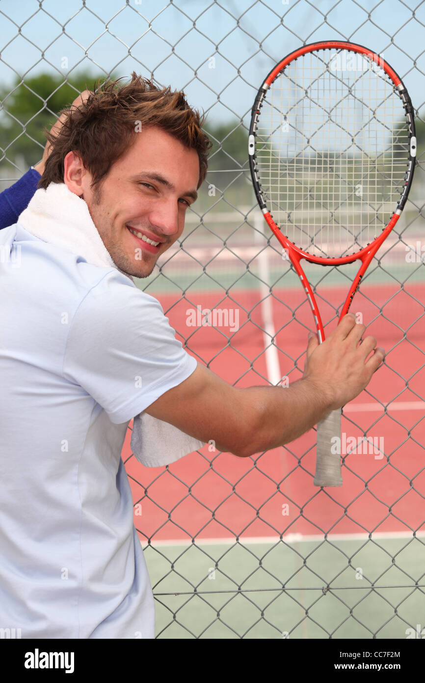 Man holding tennis racket Stock Photo - Alamy