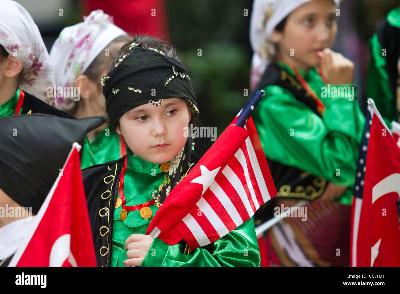 Young children in native costumes holding Turkish flags in the 2011 ...