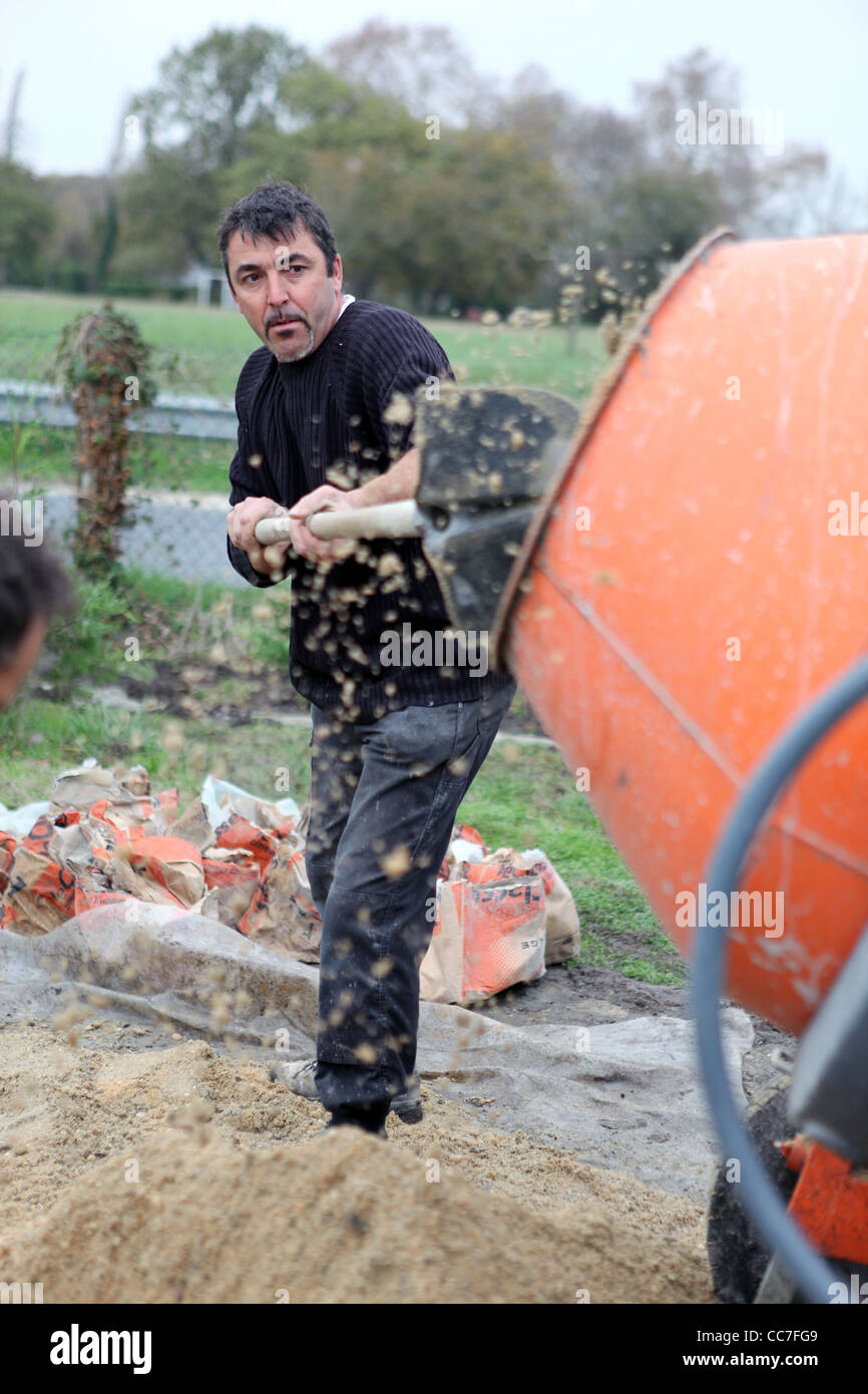 craftsmen making cement Stock Photo - Alamy