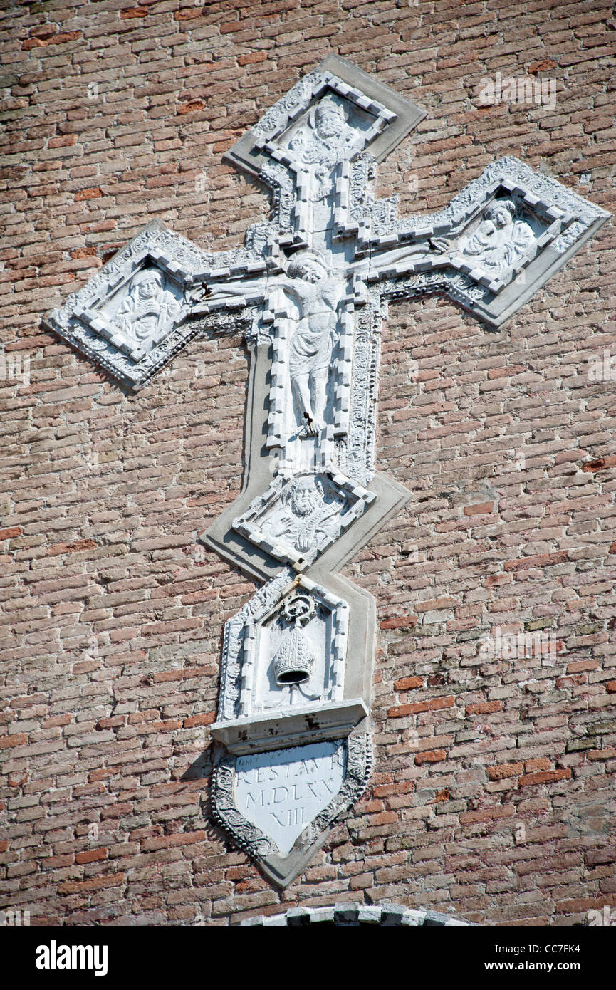 Stone cross on a wall in Venice, Italy Stock Photo - Alamy