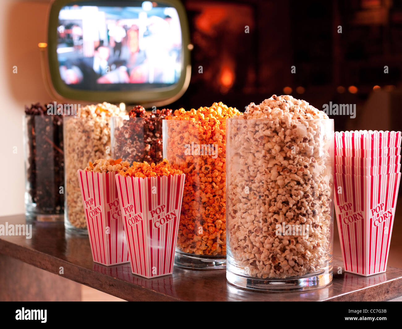 Various flavors of popcorn in containers Stock Photo - Alamy