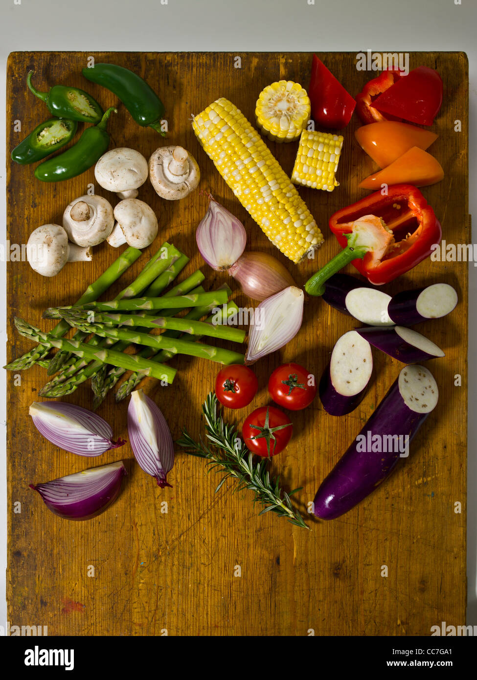 Variety of fresh vegetables on cutting board Stock Photo - Alamy