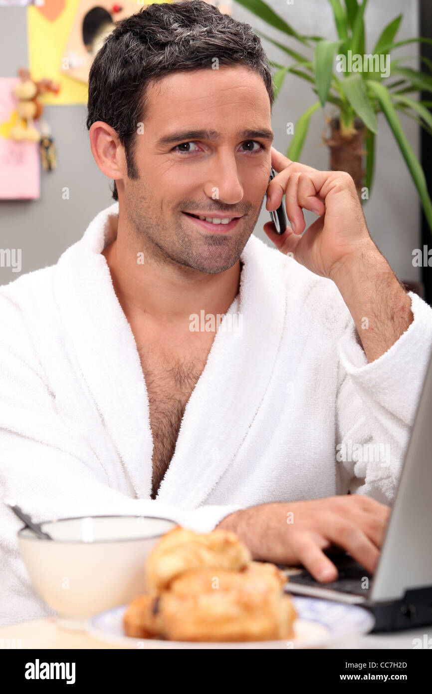 Man working over breakfast hi-res stock photography and images - Alamy