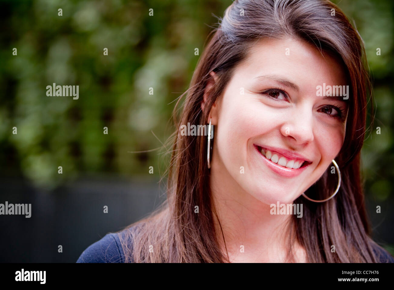 Smiling Hispanic woman Stock Photo - Alamy