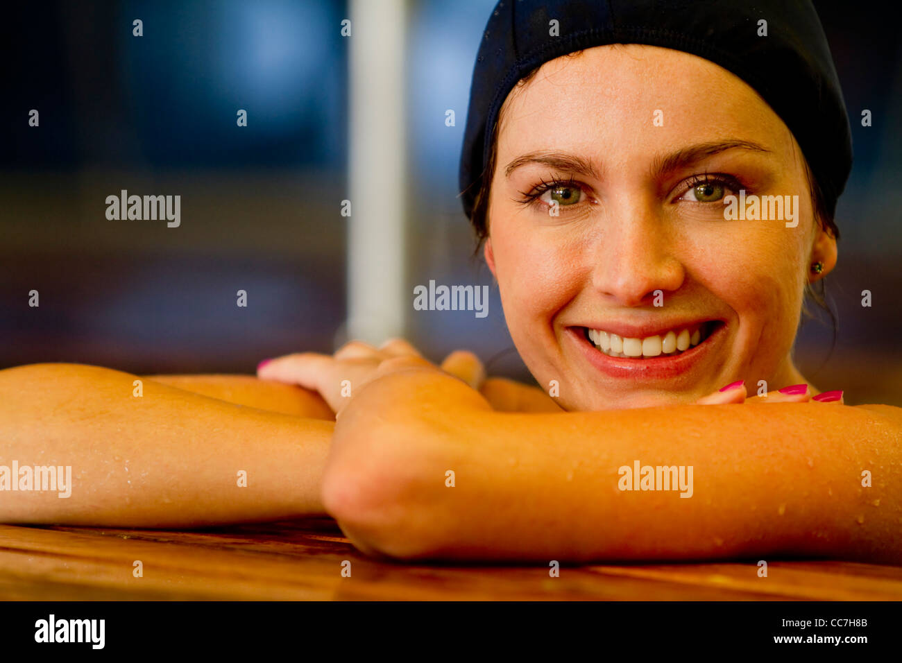 Woman Leaning At The Edge Of Swimming Pool High Resolution Stock ...