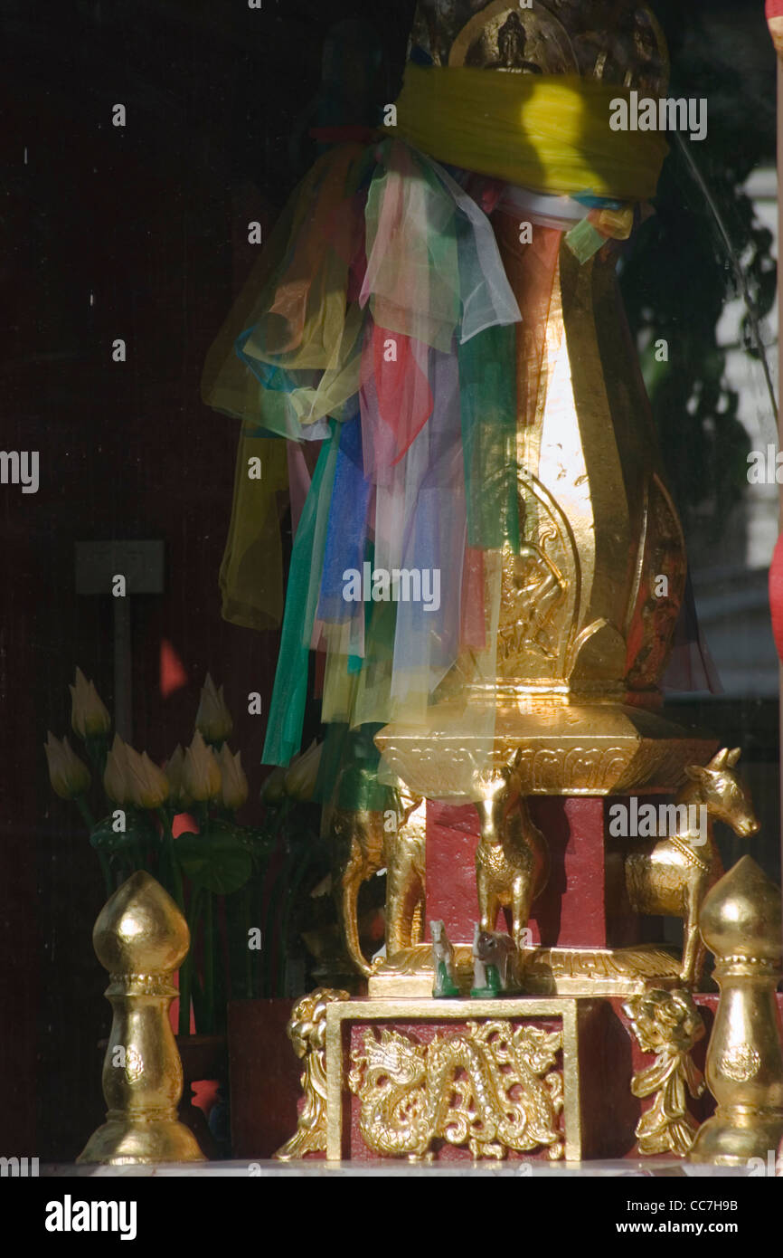 A beautiful altar is on display in a small pagoda at a Buddhist temple ...