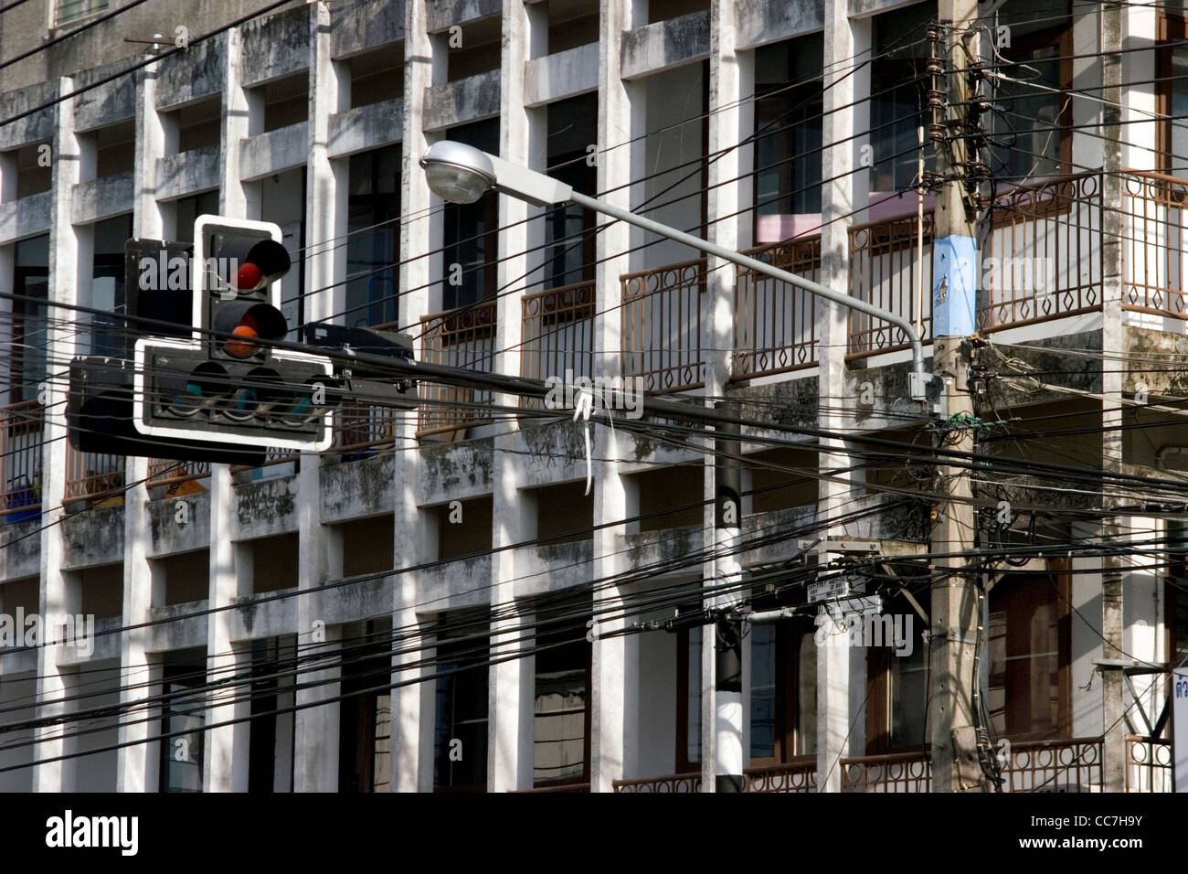 A traffic light, as well as power and telephone lines are part of the ...