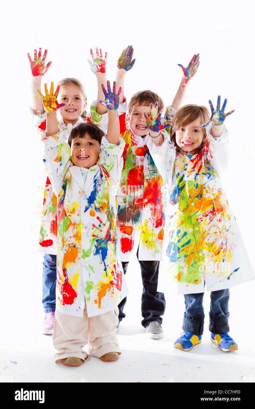 Messy Hispanic children finger painting Stock Photo - Alamy
