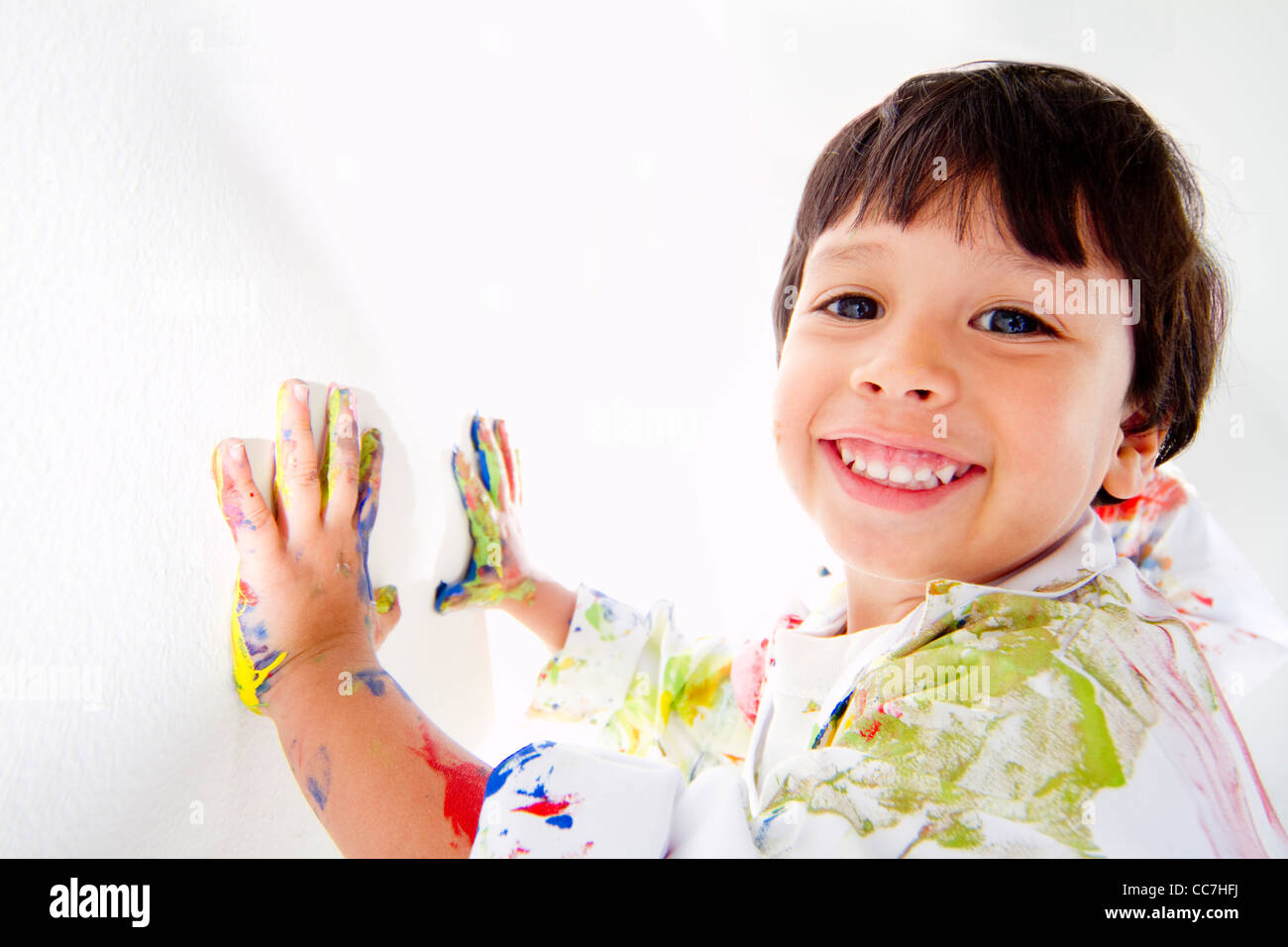 Hispanic boy finger painting Stock Photo - Alamy