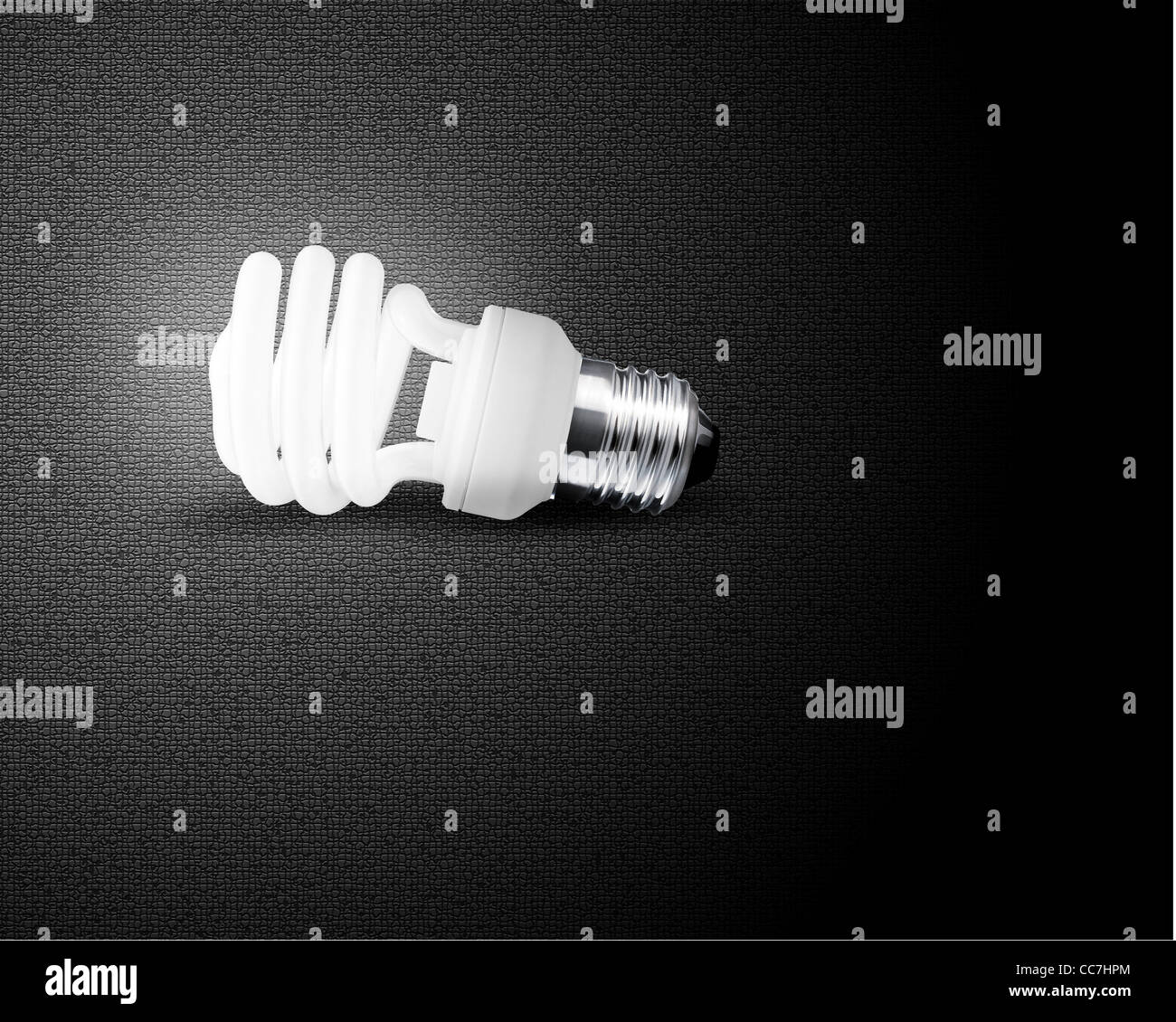 one glowing Light bulb on black background Stock Photo - Alamy