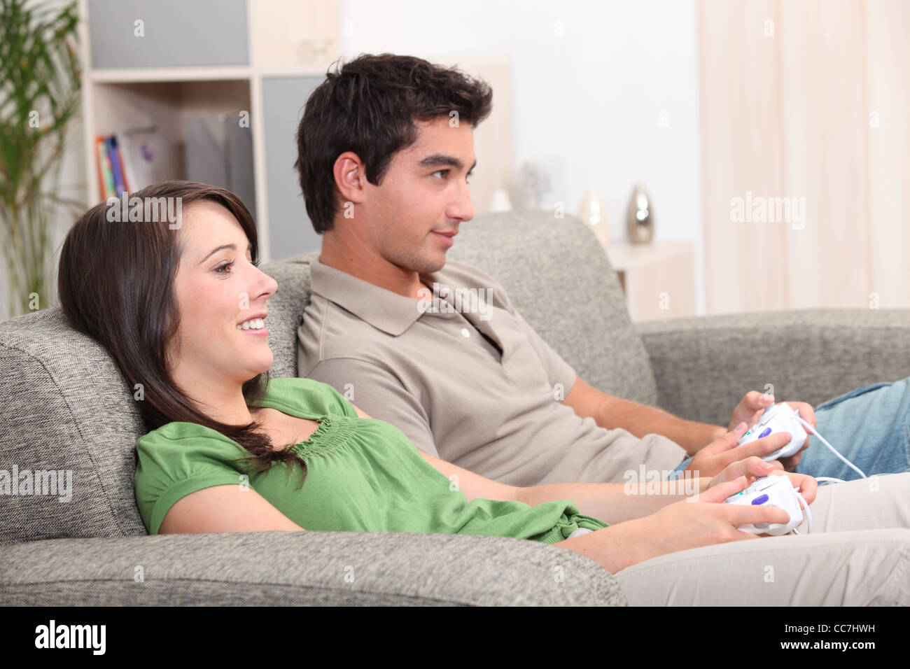 Young people playing computer games Stock Photo - Alamy