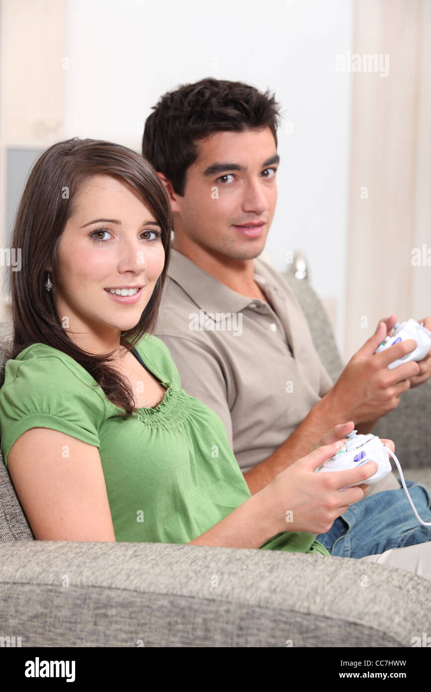 young people playing video games Stock Photo - Alamy