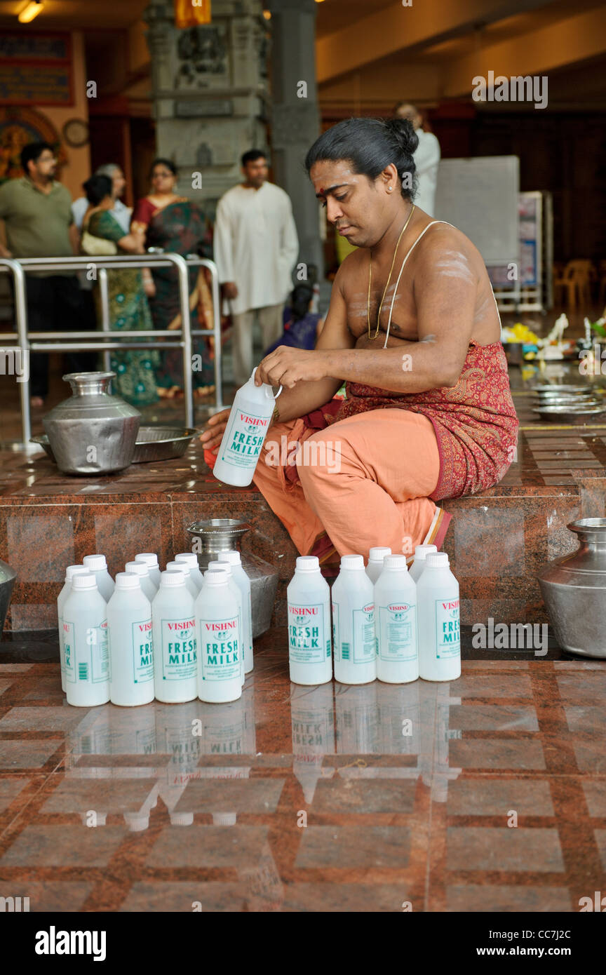High priest with milk bottles, Sri Senpaga Vinayagar Temple, Singapore ...