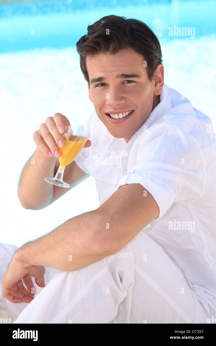 man drinking cocktail Stock Photo - Alamy