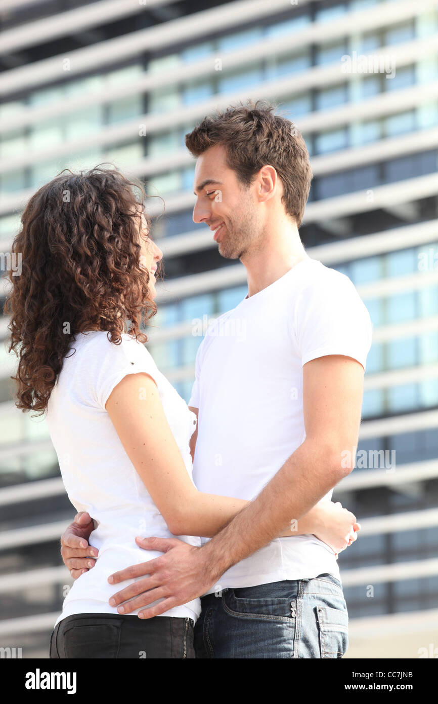 Couple hugging in the city Stock Photo - Alamy