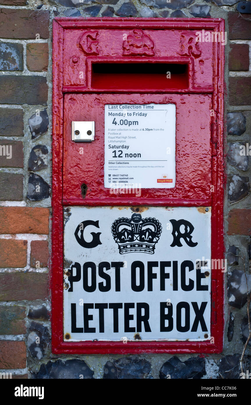 Post office letter box built into the front of a house Stock Photo - Alamy
