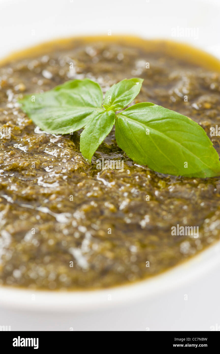 Bowl with pesto and fresh basil Stock Photo - Alamy