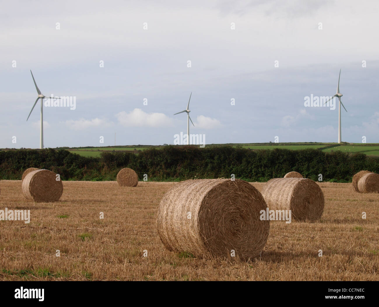 Round hay bales and wind turbines, Cornwall, UK Stock Photo - Alamy