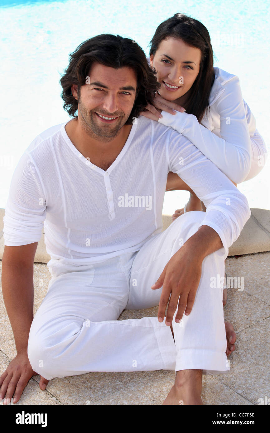 Woman in white leaning on her partner's shoulder Stock Photo - Alamy