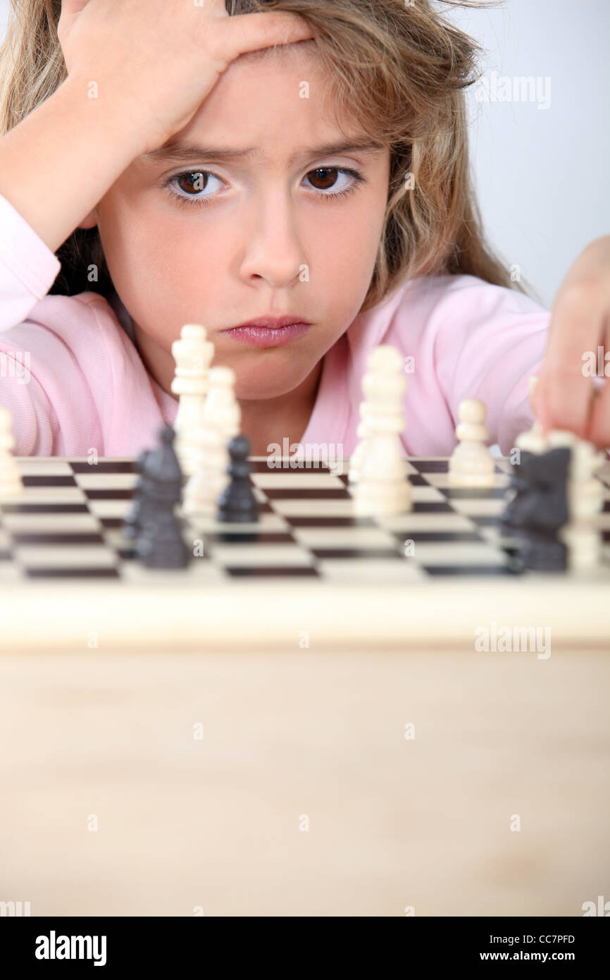 Serious looking chess player hi-res stock photography and images - Alamy