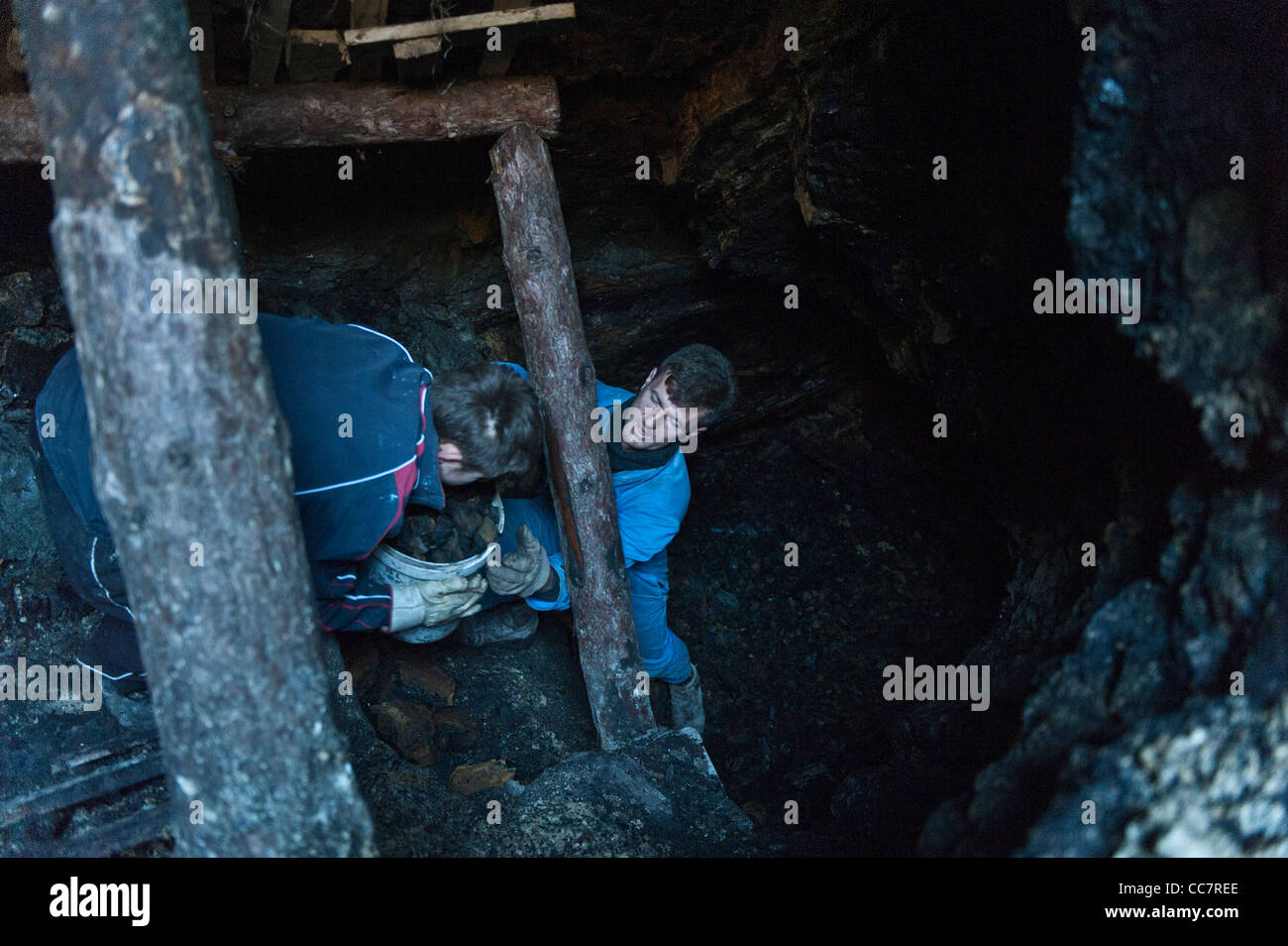 Two illegal miners digging coal Stock Photo - Alamy