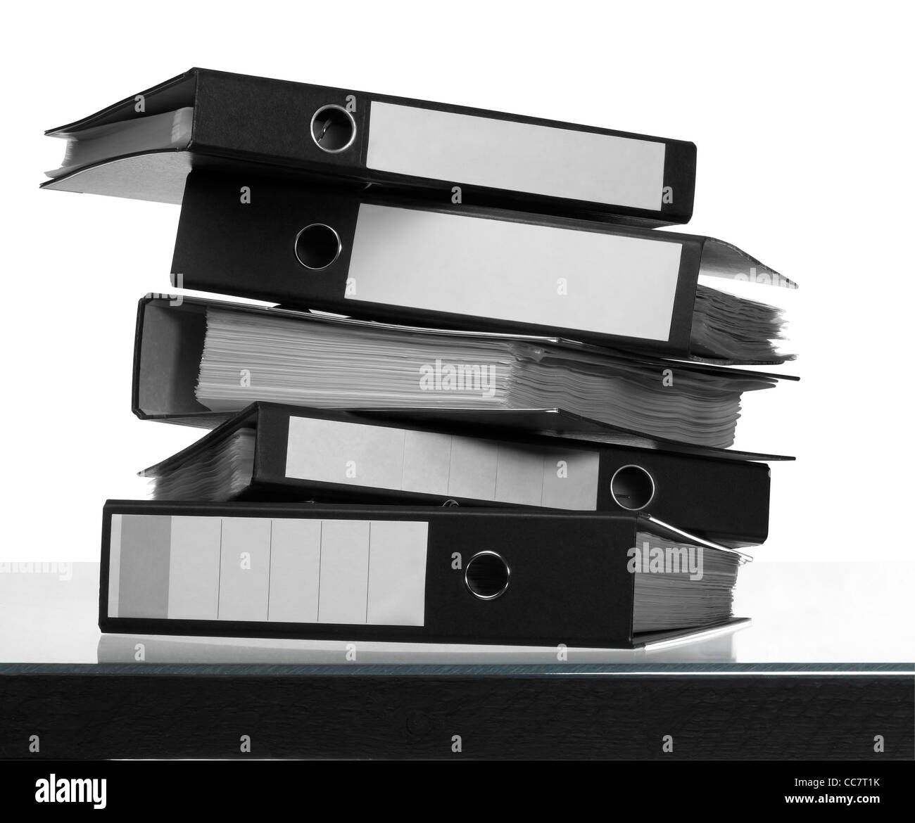 some Folders on desk surface in white back Stock Photo - Alamy