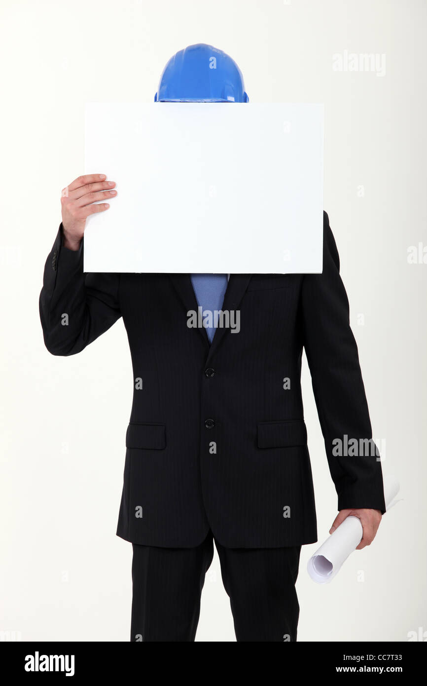 construction businessman hiding his face with a blank poster Stock ...