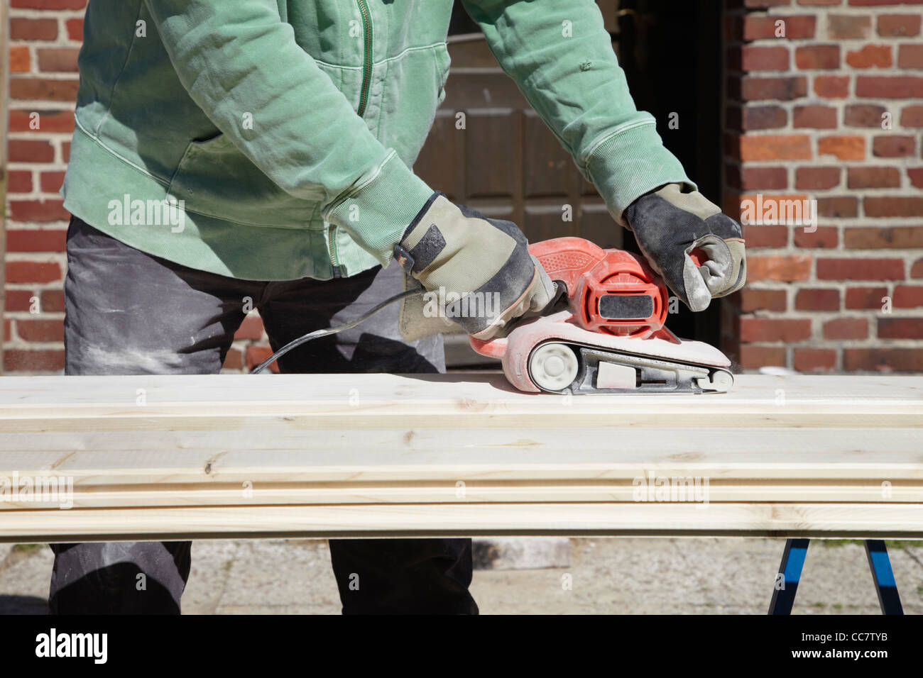 Man Sanding Planks of Wood, Feldhusen, Germany Stock Photo - Alamy