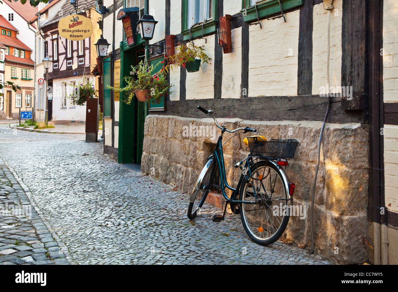 Bicycle in a cobbled street of half-timbered medieval houses in the ...
