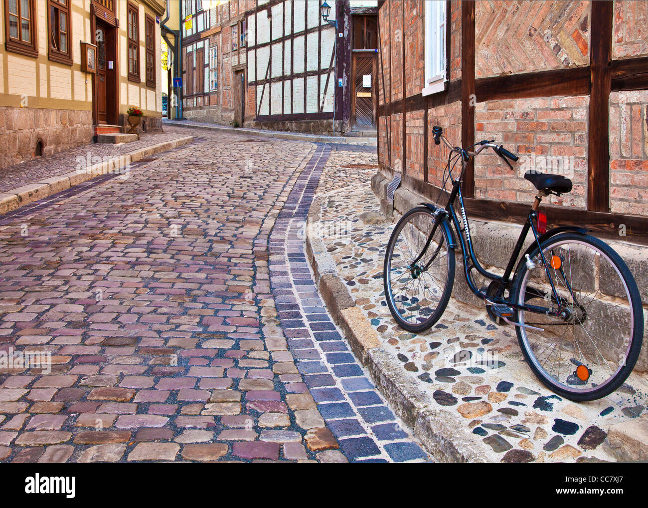 Bicycle in a cobbled street of half-timbered medieval houses in the ...