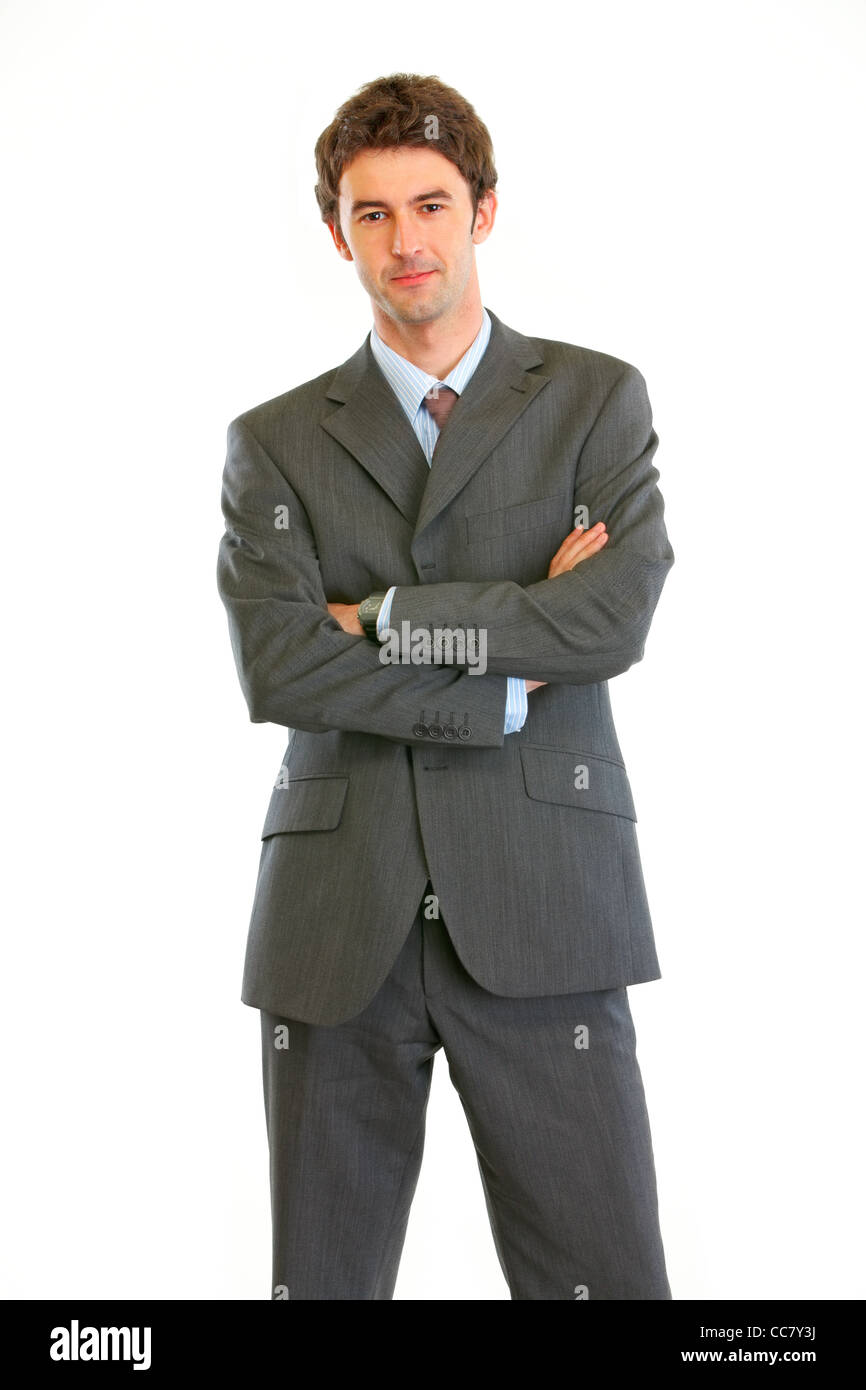 Authoritative modern businessman with crossed arms isolated on white ...