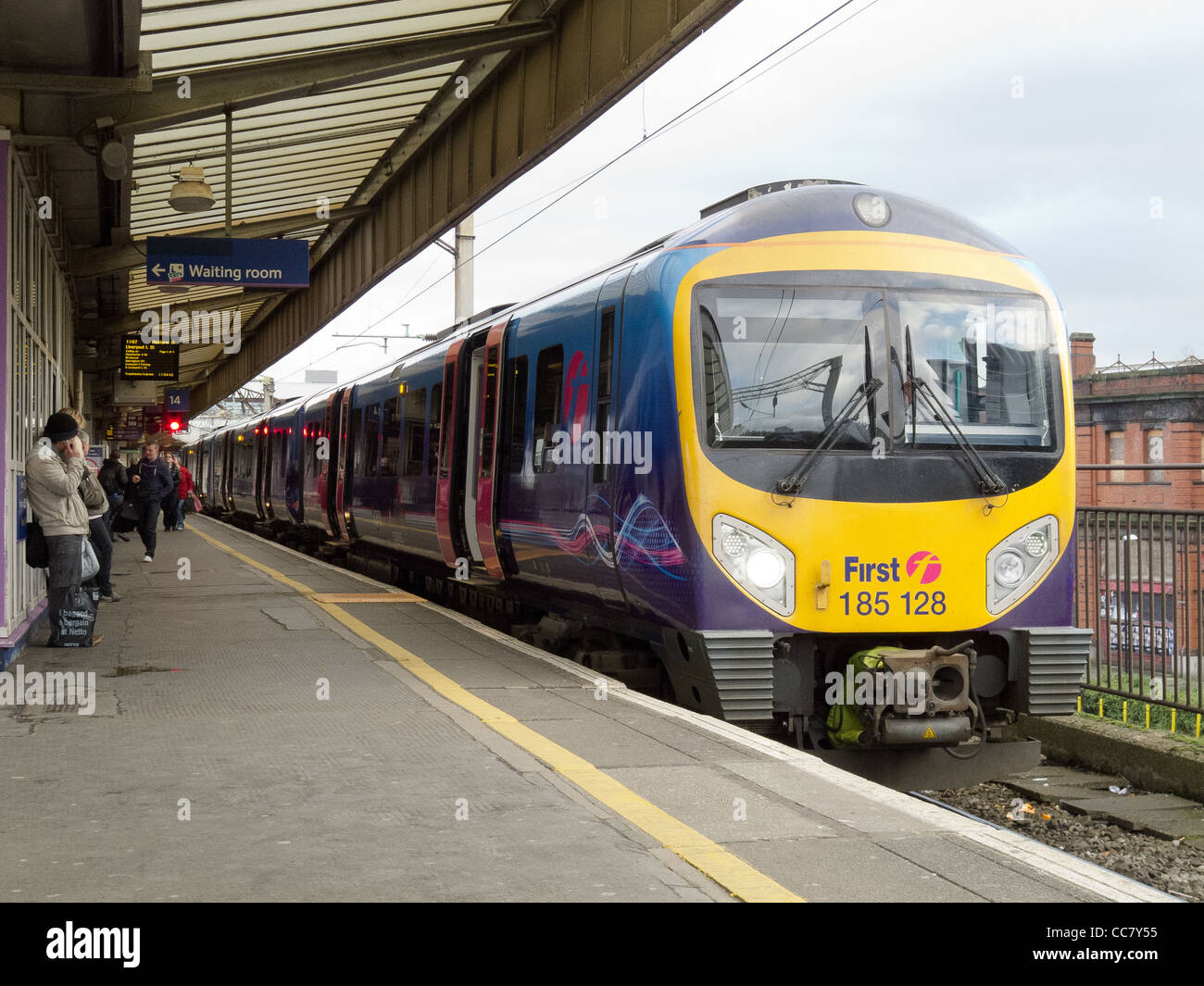 Platform 14 and a passenger train arriving at Manchester Piccadilly ...