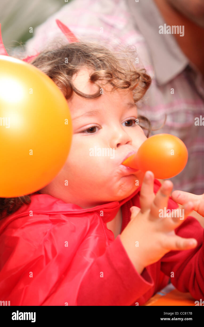 Boy Blowing Up Red Balloon High Resolution Stock Photography and Images ...