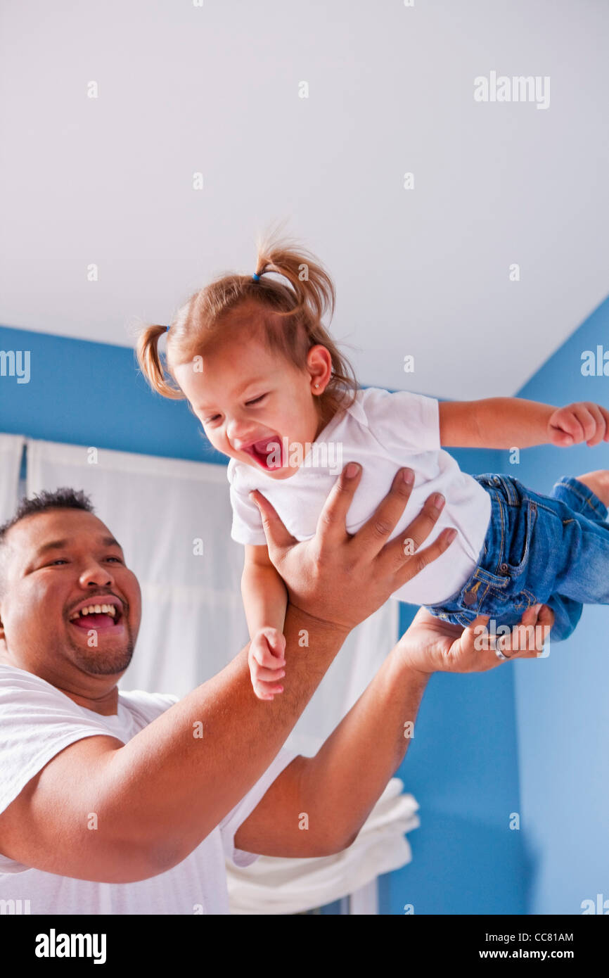 Father Lifting Daughter into the Air Stock Photo - Alamy