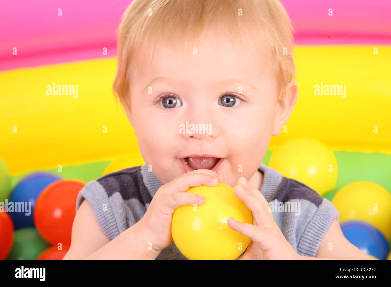 Birthday of fun boy in color balls Stock Photo - Alamy