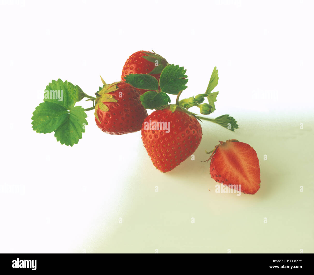 Cut out: Strawberries with leaves, in whole and cut Stock Photo - Alamy